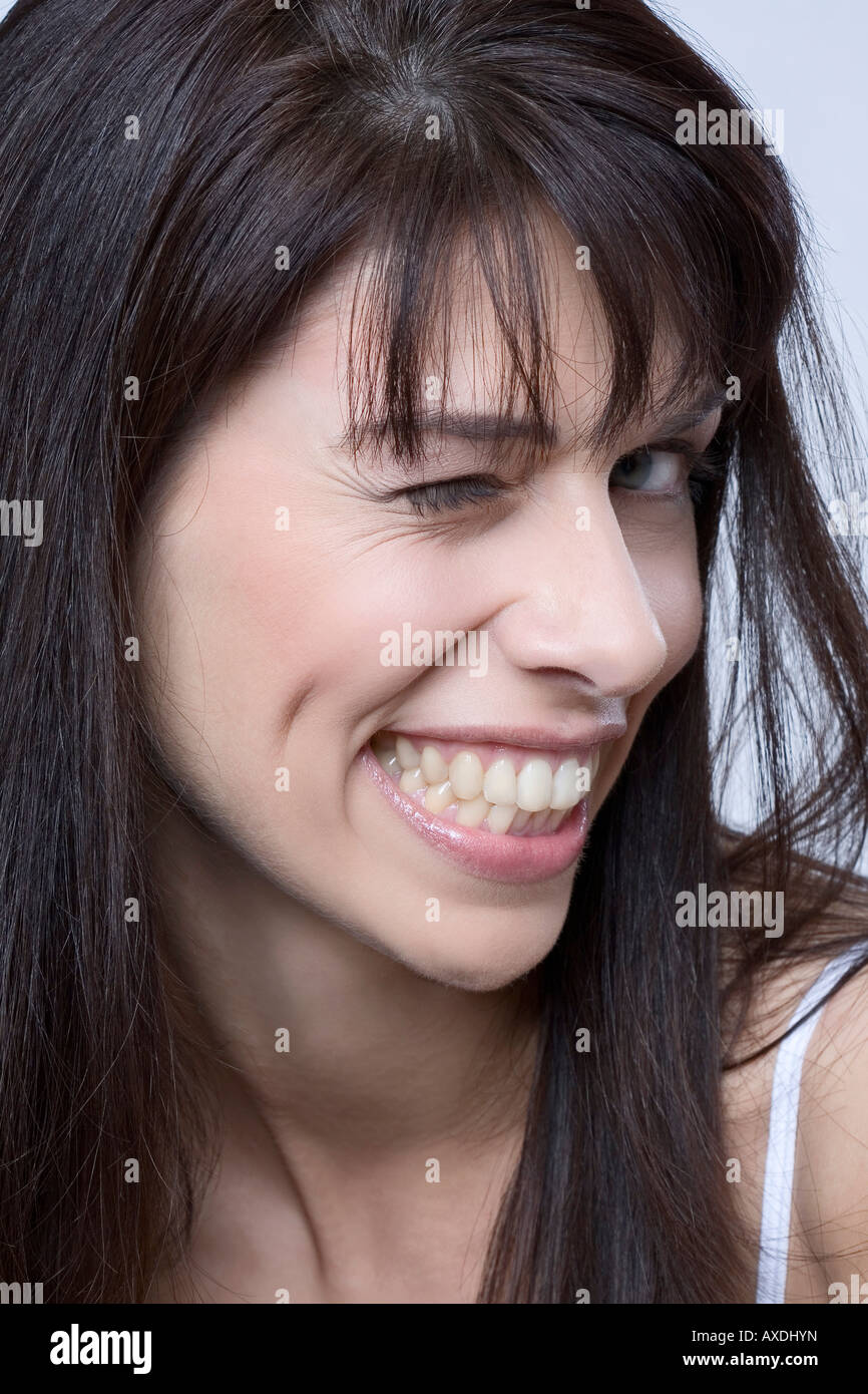 Brunette woman pulling faces, portrait Stock Photo - Alamy