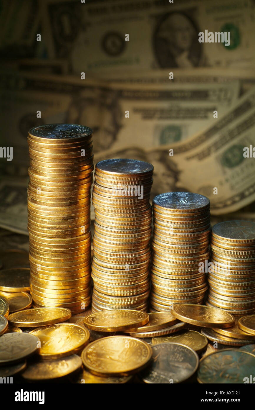 Coins and dollars wealth and riches concept Dollar coins along with ...