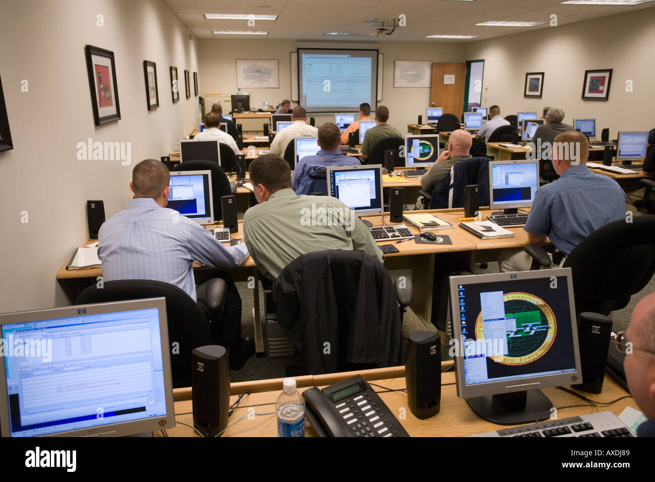 Police officers and detectives learning how to use software developed ...