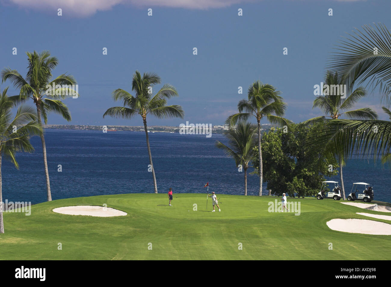 Three Golfers Putting Stock Photo - Alamy