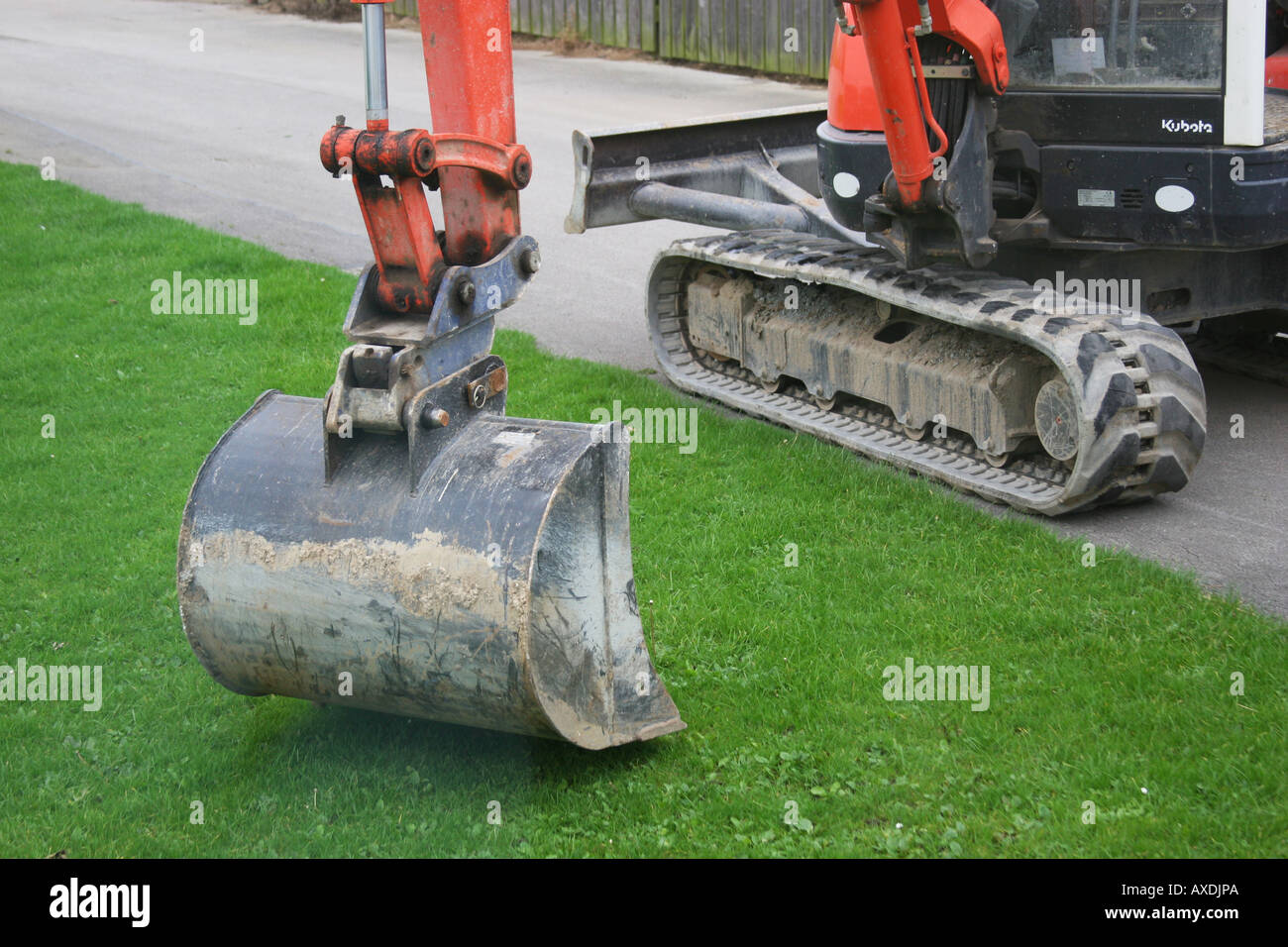 Digger bucket on small excavation machine Stock Photo - Alamy