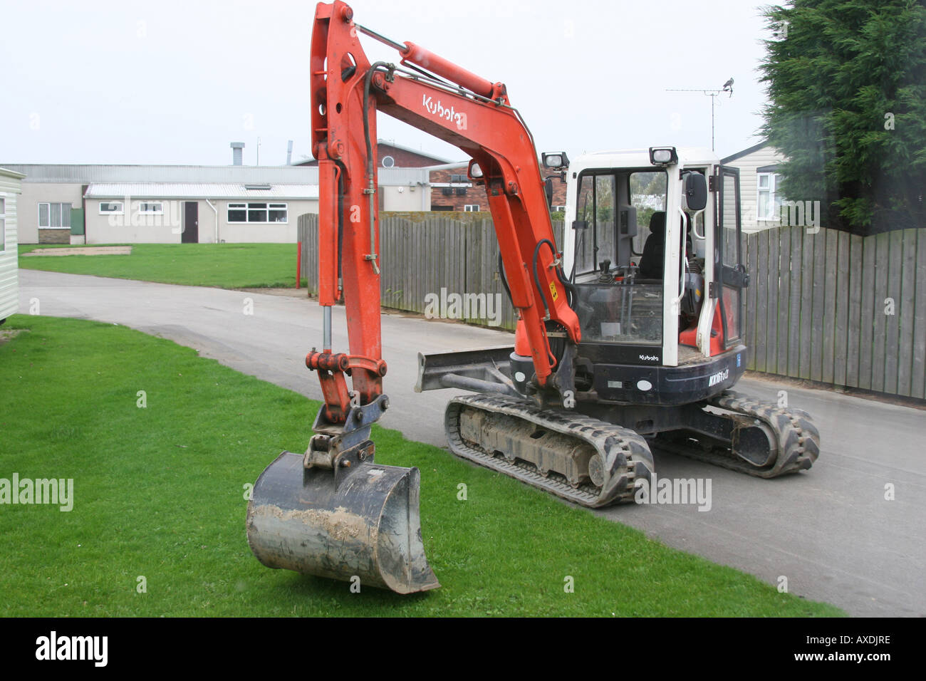 Small digging machine on tracks ready to work Stock Photo - Alamy