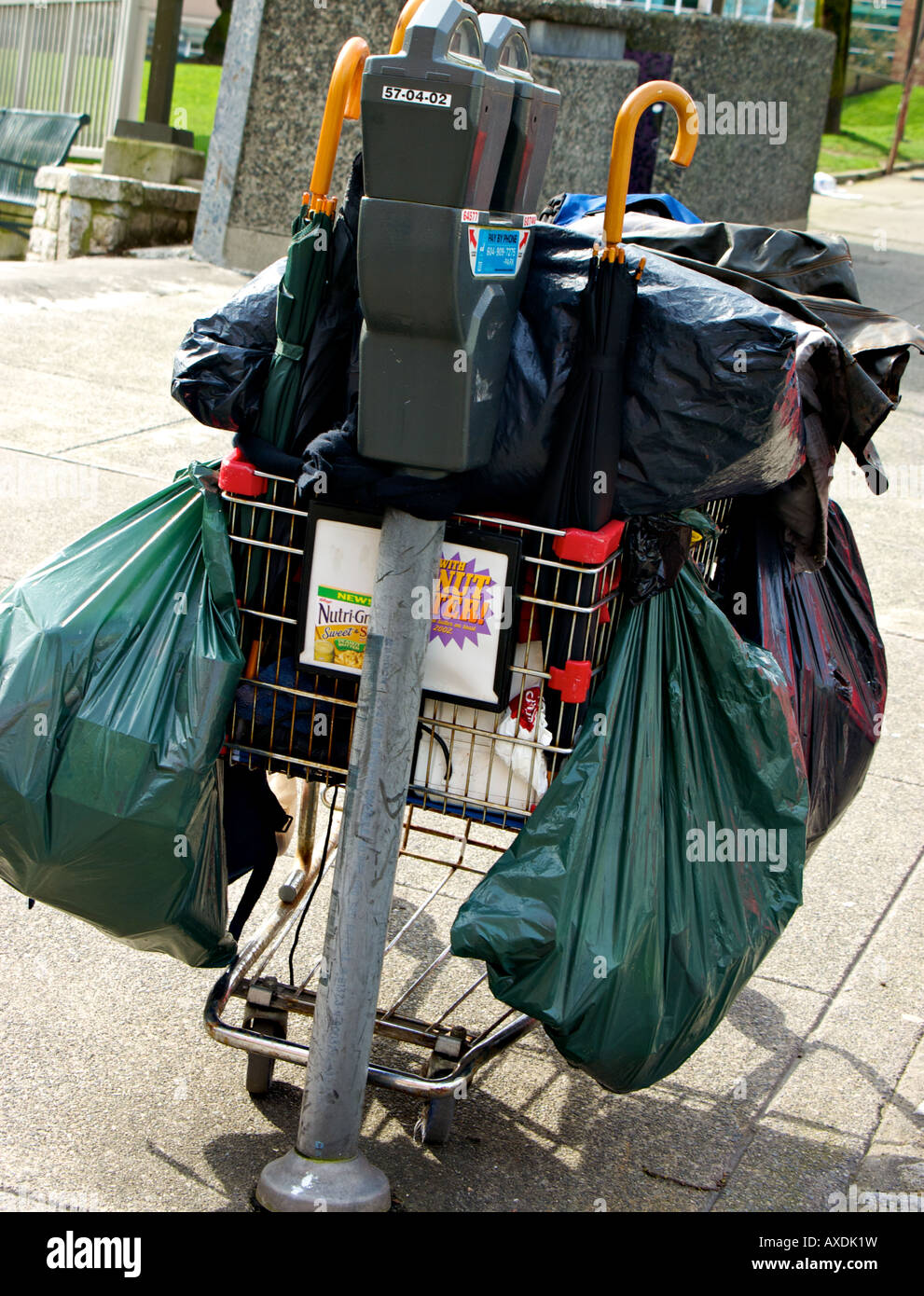 Homeless person's shopping cart in downtown Stock Photo - Alamy