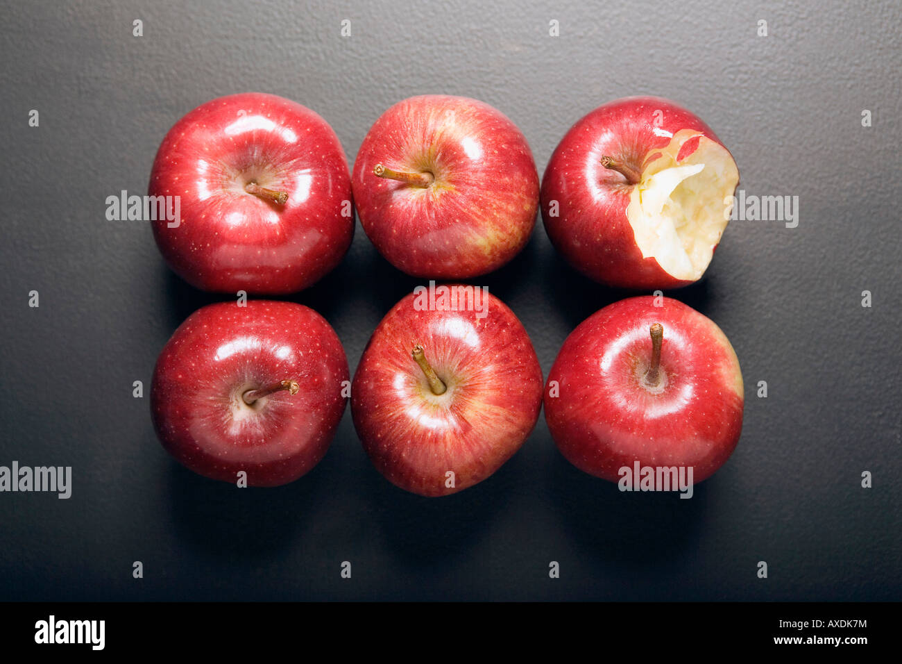 Red apples, one bitten inside, elevated view Stock Photo - Alamy