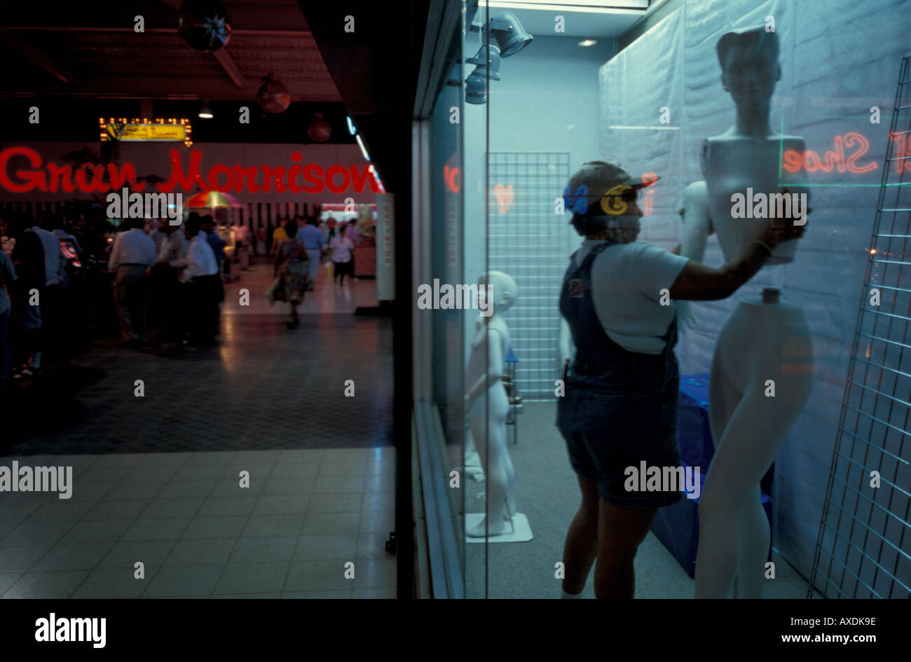 worker rearranges mannequin in a panama city mall Stock Photo - Alamy