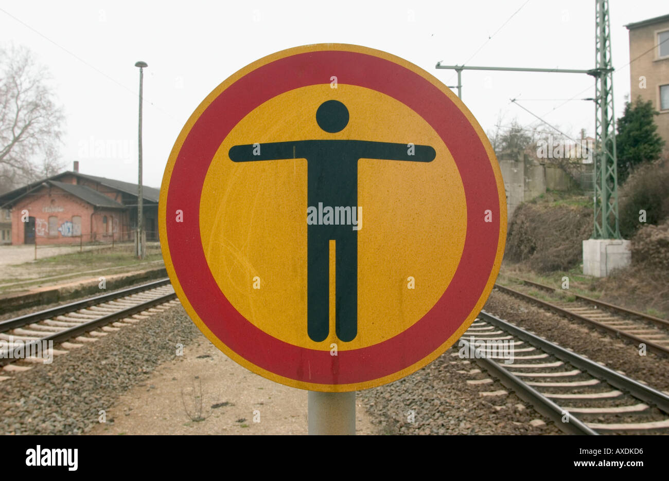warning sign near a railway track Stock Photo - Alamy