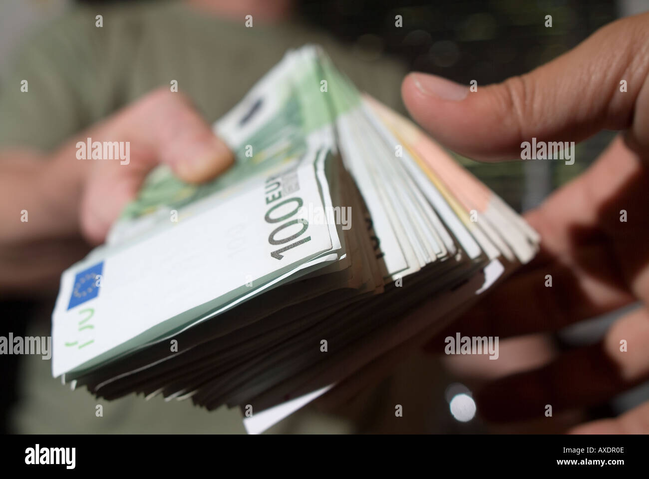Person handing cash Stock Photo - Alamy