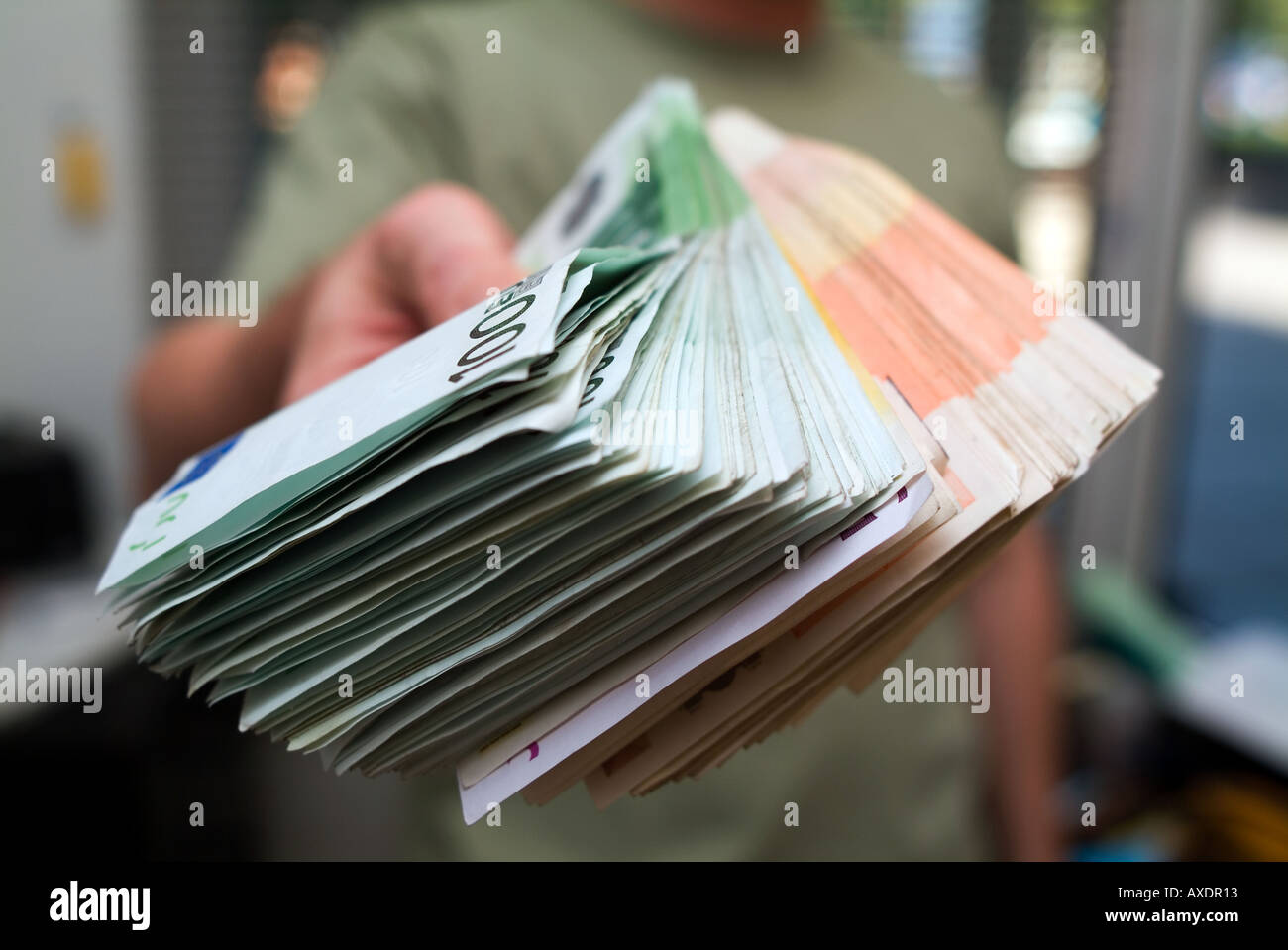 Person handing cash Stock Photo - Alamy