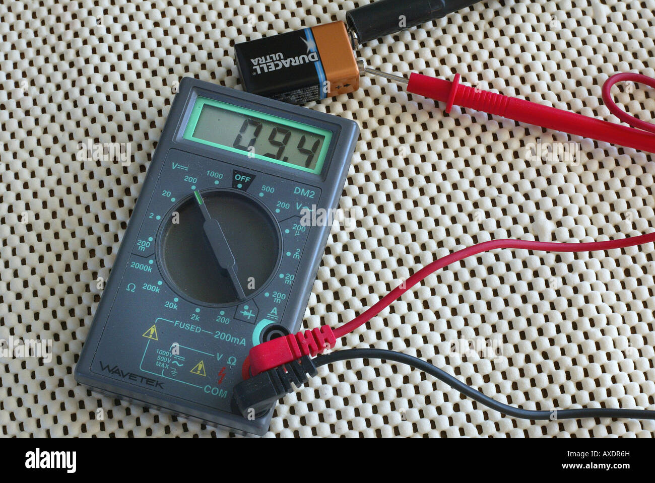 Voltmeter measures battery power level Stock Photo - Alamy
