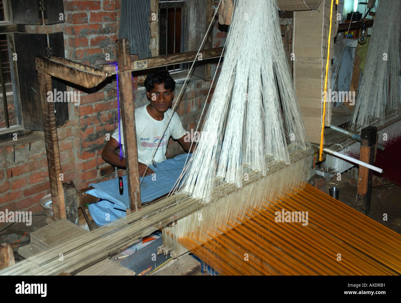 Man weaving silk in workshop, Varanasi, India Stock Photo - Alamy