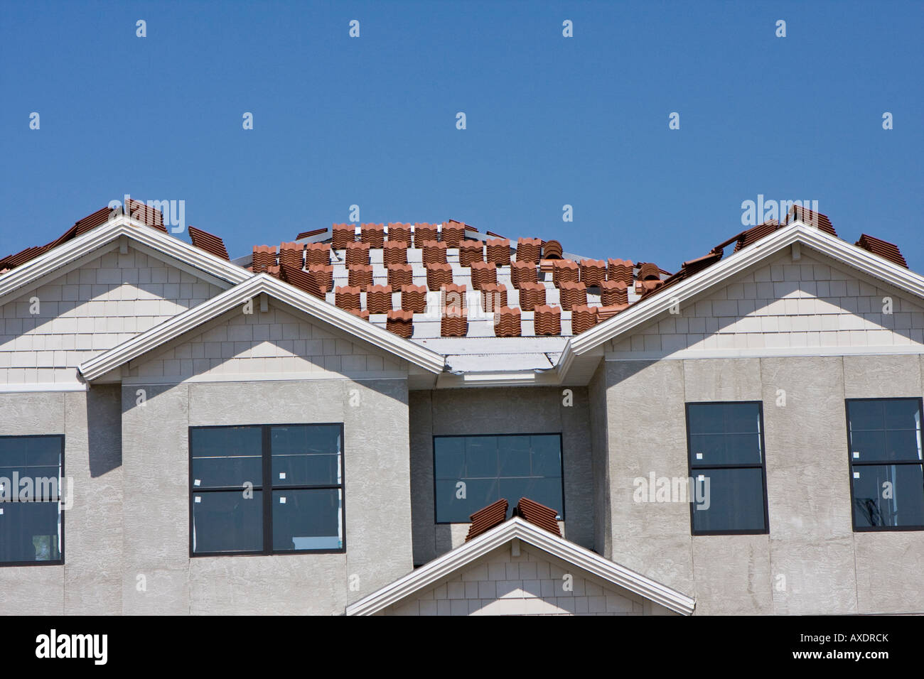 Spanish Tile Stacked on Roof of Newly Constructed House Stock Photo - Alamy