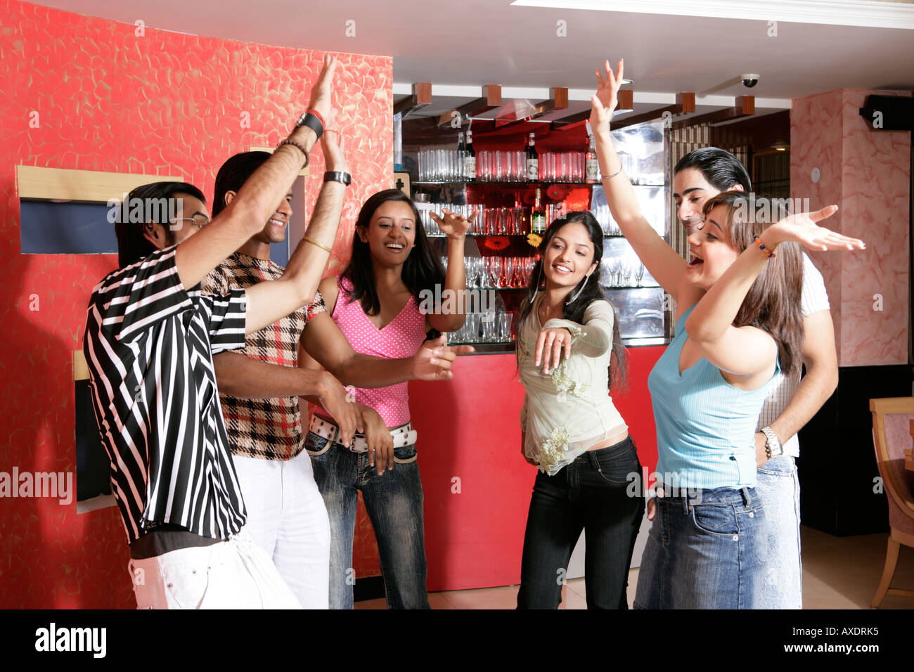 Teenage friends dancing in a party Stock Photo - Alamy