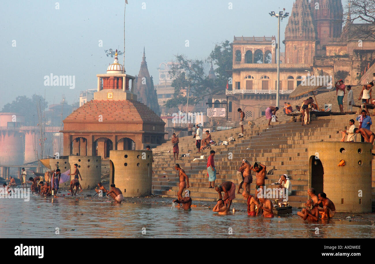 Hindu pilgrims bathing in Ganges at dawn Stock Photo - Alamy