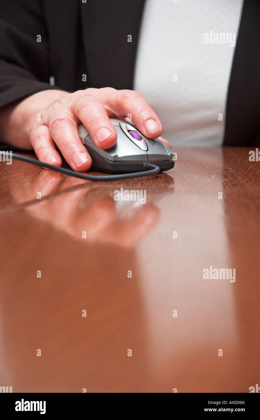 Businesswoman using computer mouse Stock Photo - Alamy