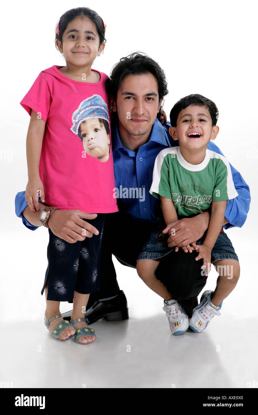 Father with his kids smiling Stock Photo - Alamy