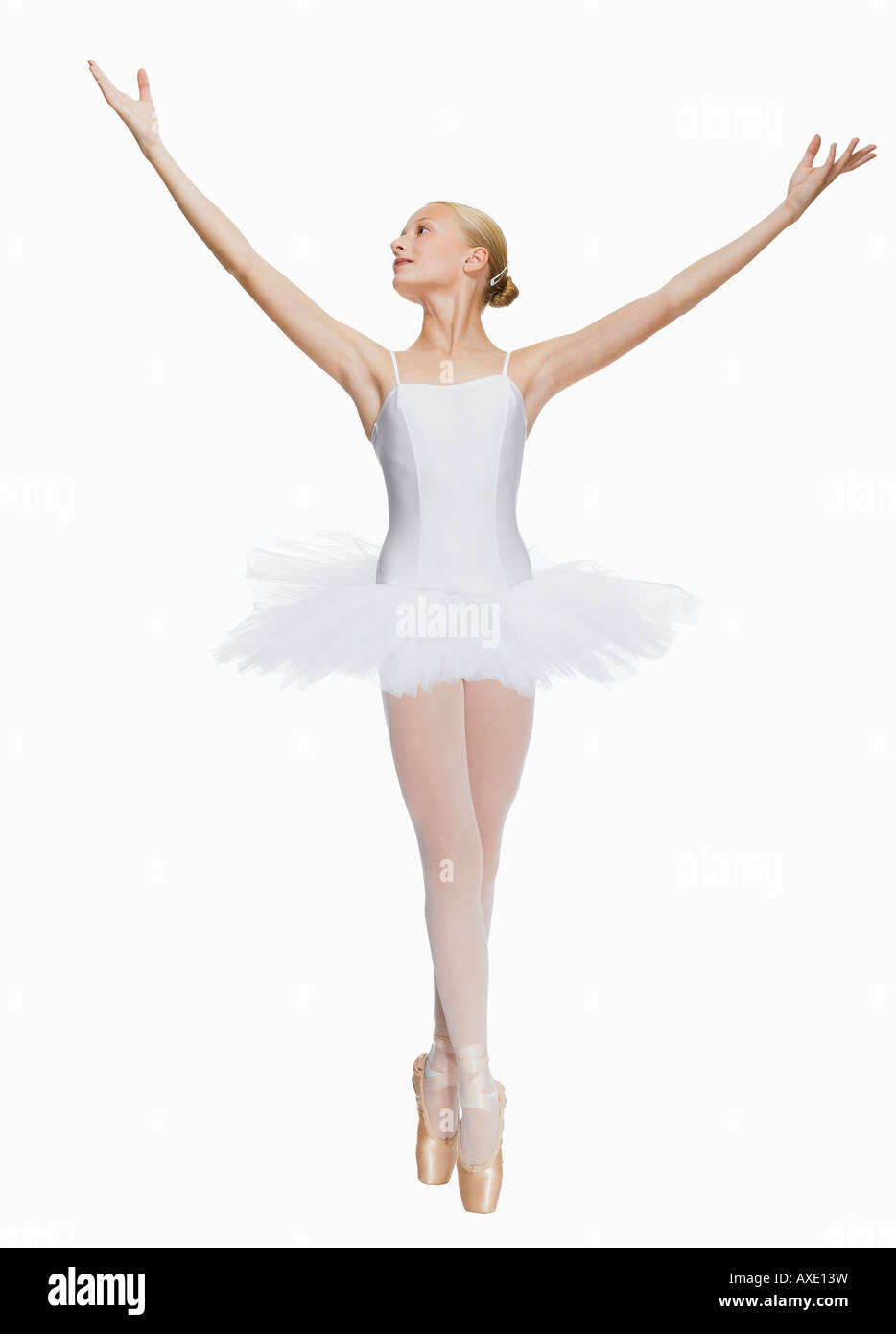 Young ballerina (14-15) standing on pointe in toe shoes,, portrait ...
