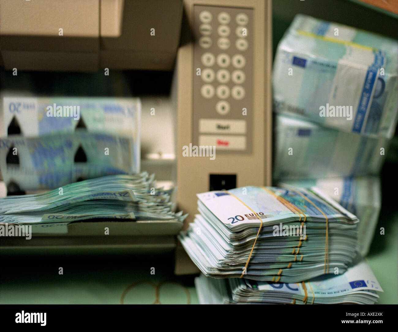 A counting machine and Euro bank notes The 20 Euro notes are banded ...