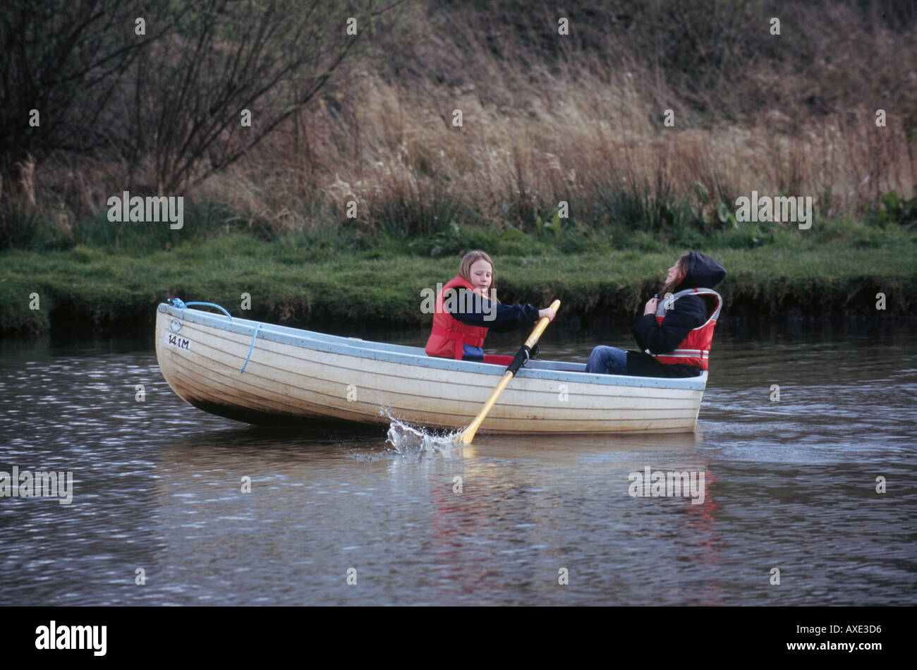 Two girls rowing boat in hi-res stock photography and images - Alamy