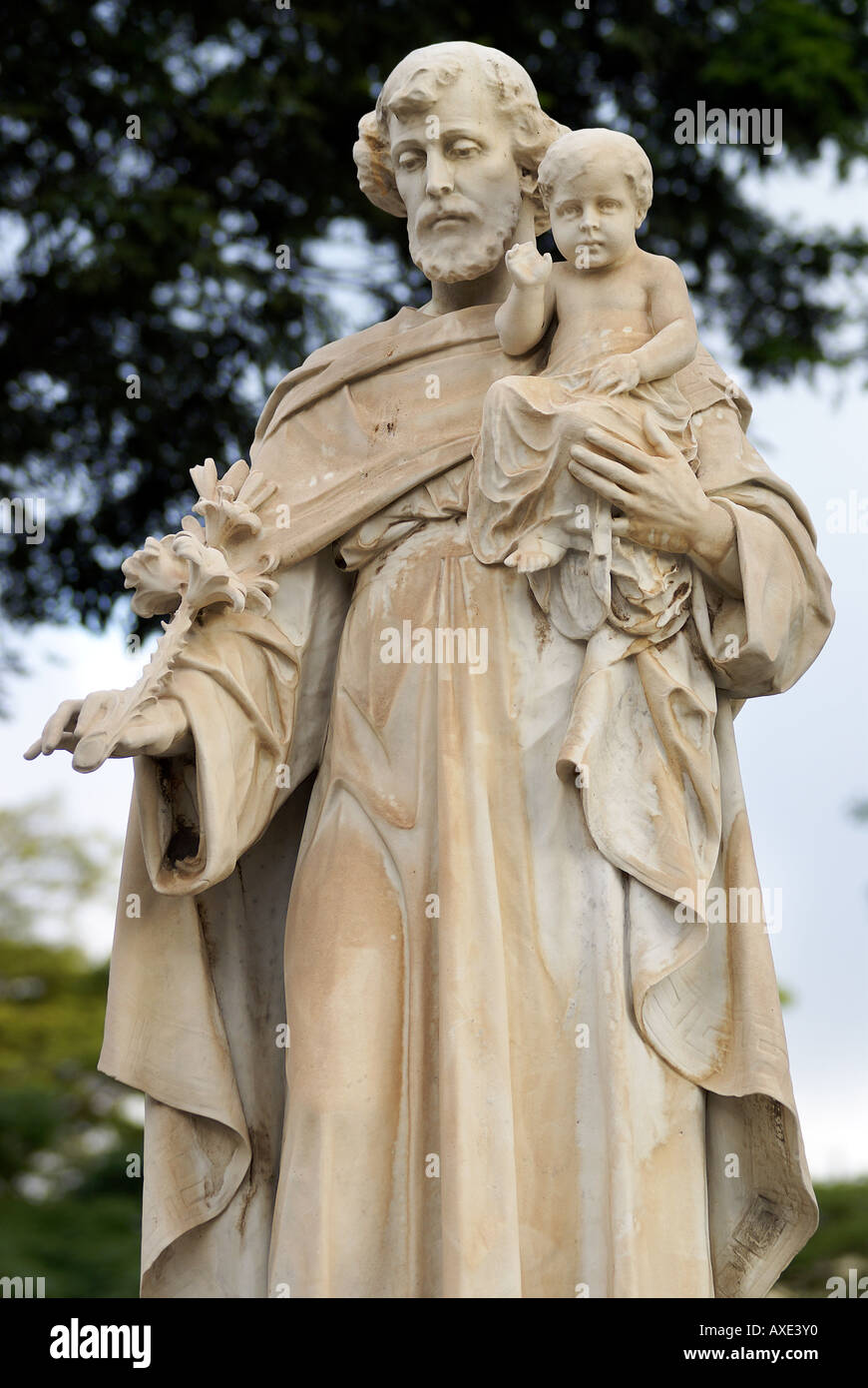 Statue of Saint Antony holding a Lily and the infant Jesus in his hands ...