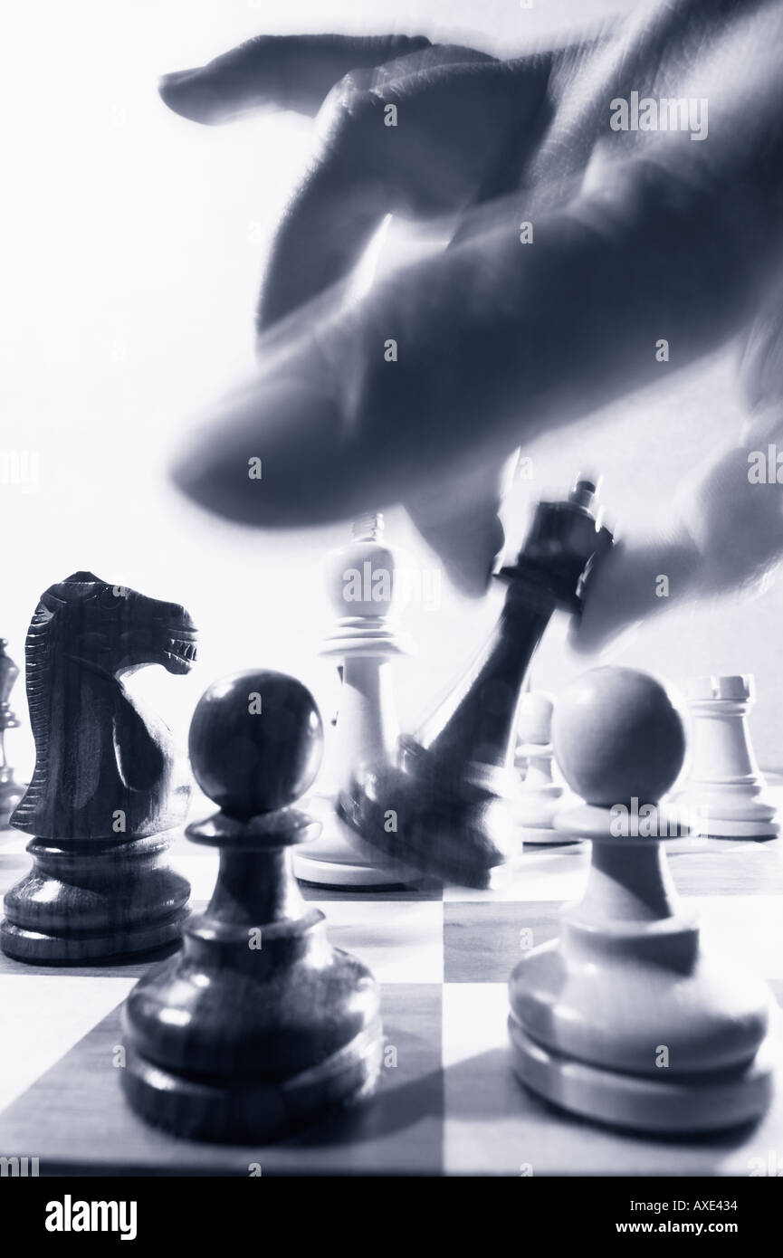 Hand moving chess piece Model Released Stock Photo - Alamy