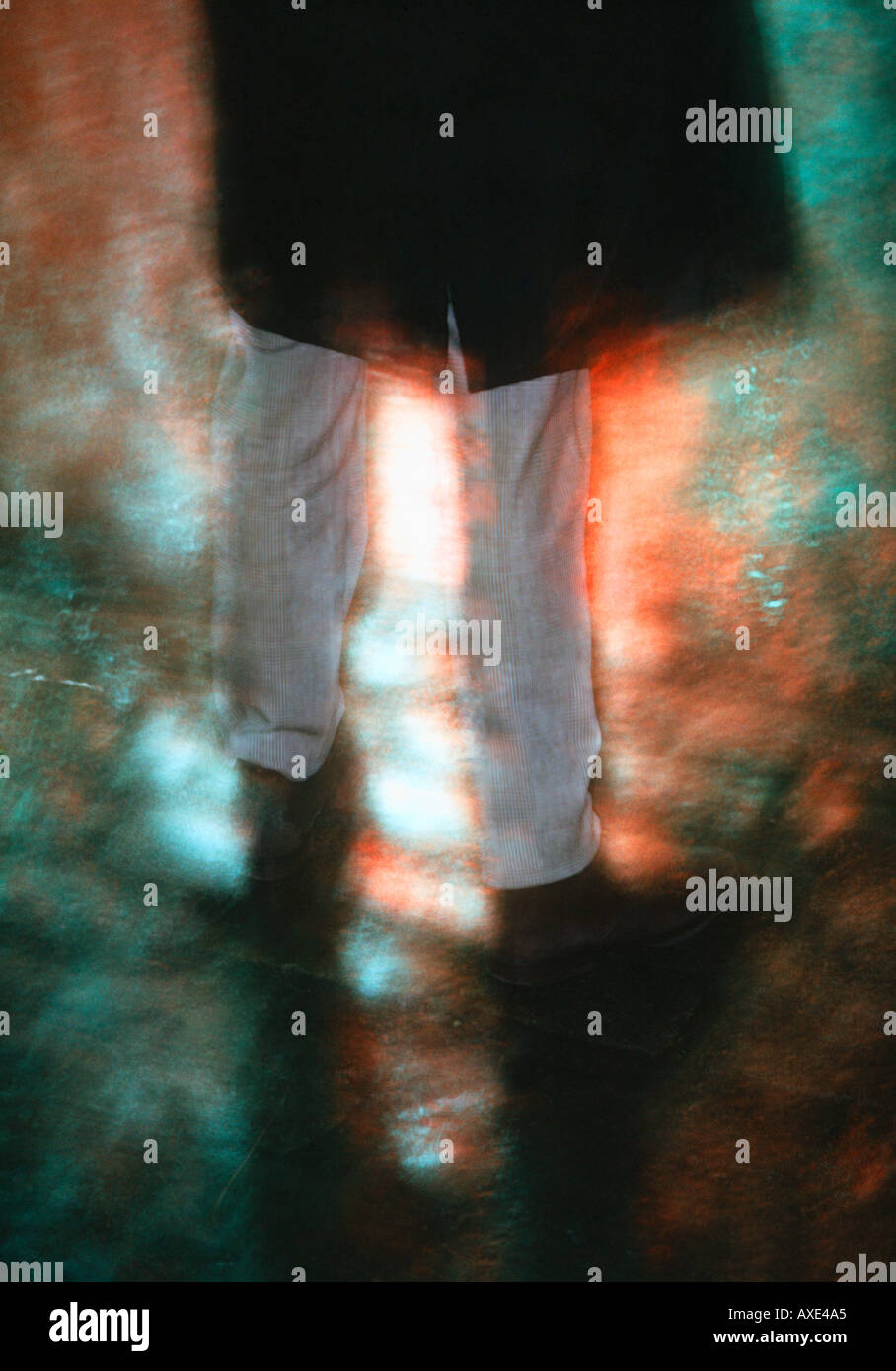 back of person standing in the rain with streetlight reflections Stock ...