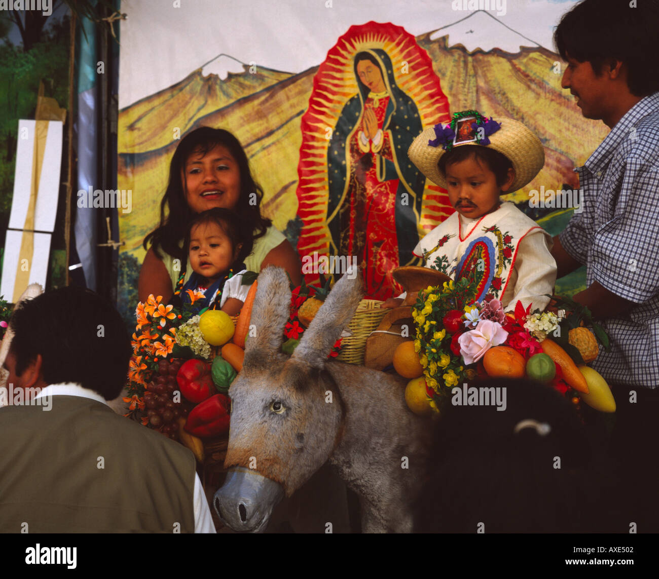 Children being photographed at the Feast of the Virgin of Guadalupe ...