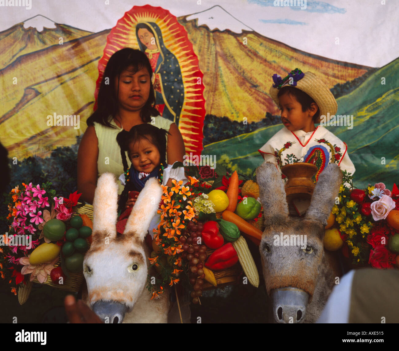 Children being photographed at the Feast of the Virgin of Guadalupe ...