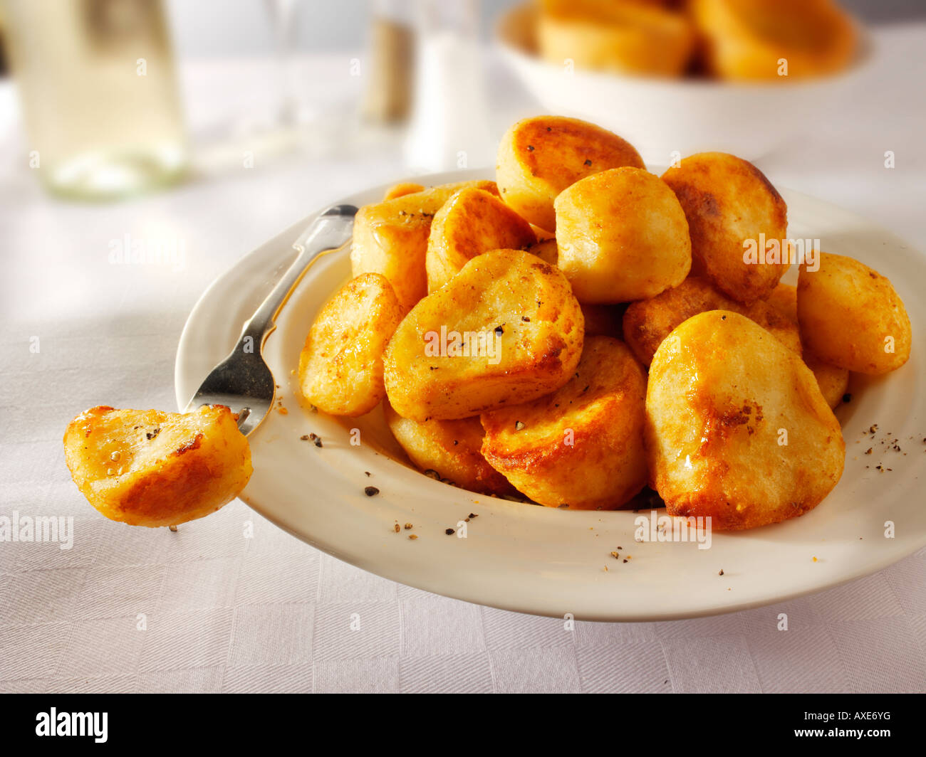 Roast Potatoes in a table setting Stock Photo - Alamy