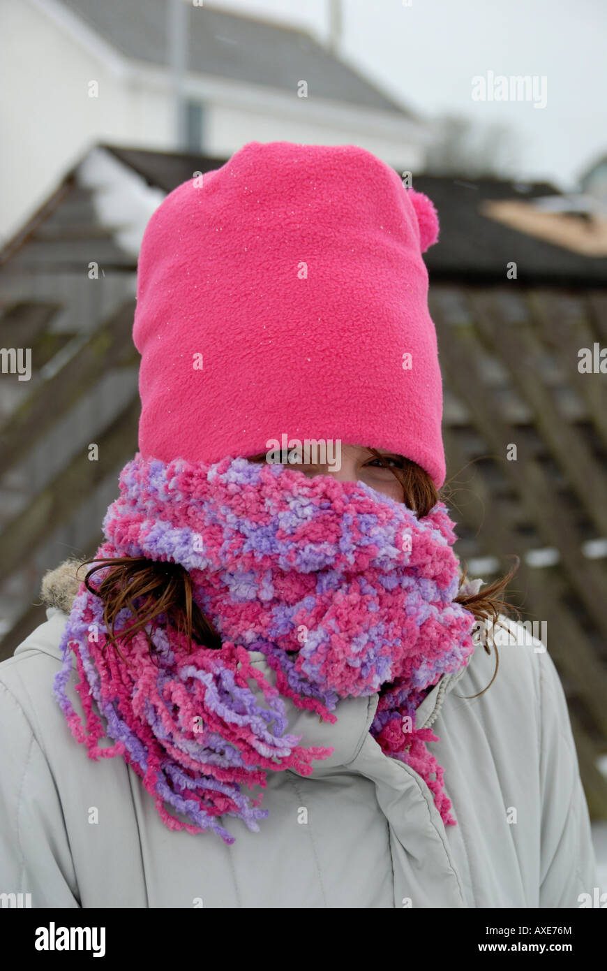 Teenage girl wrapped up against the cold Stock Photo - Alamy