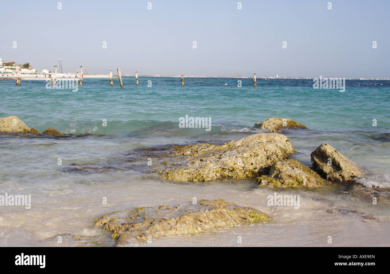 Rocks and ocean on beach Stock Photo - Alamy