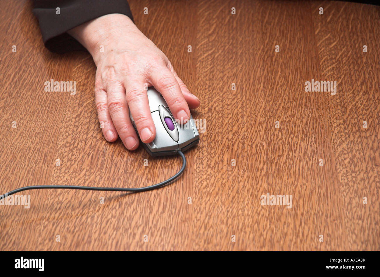 Businesswoman using computer mouse Stock Photo - Alamy