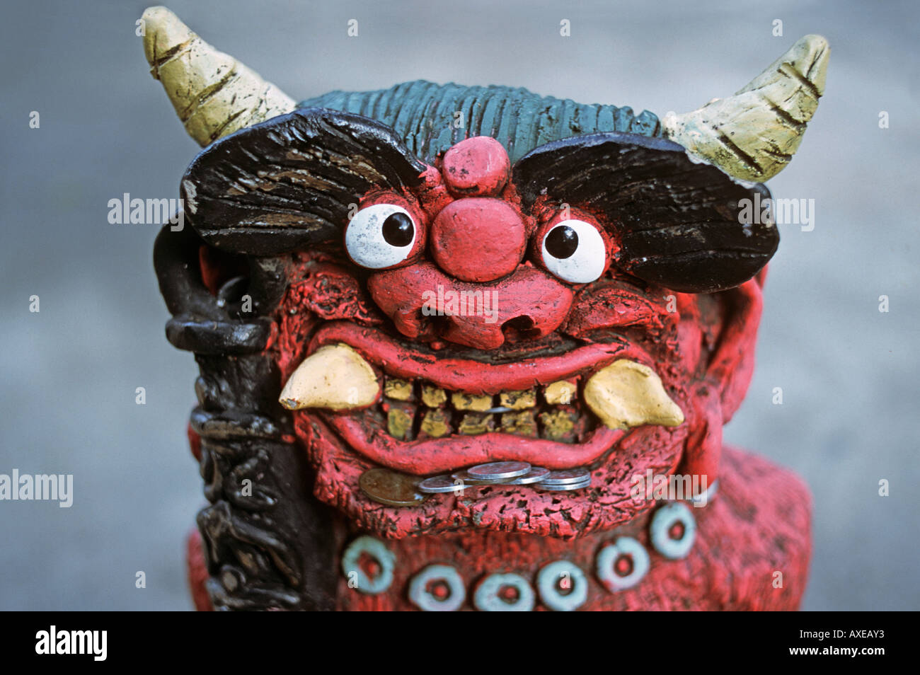 Small devilish oni statue with fearsome features Good luck charm ...