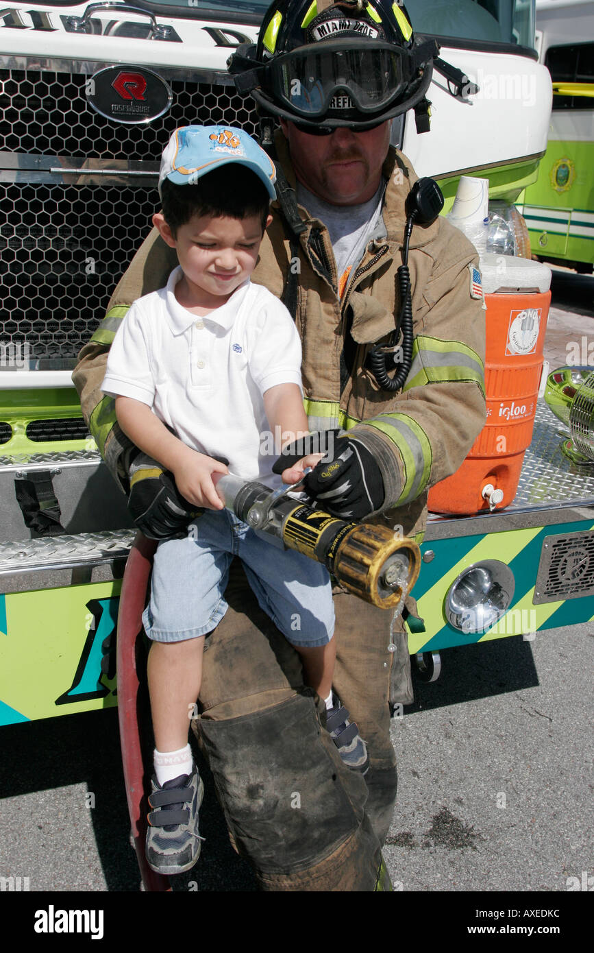 Hispanic boy boys male kids children fireman hi-res stock photography ...