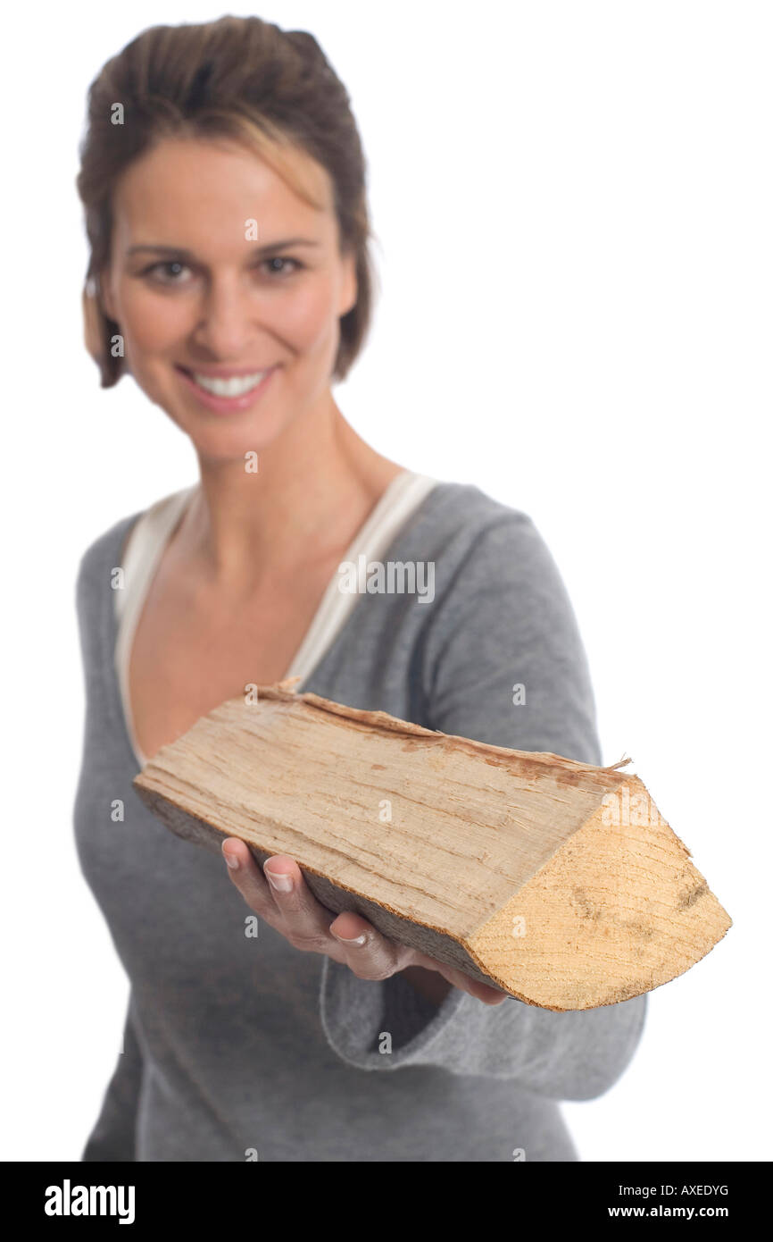 Woman holding log Stock Photo - Alamy