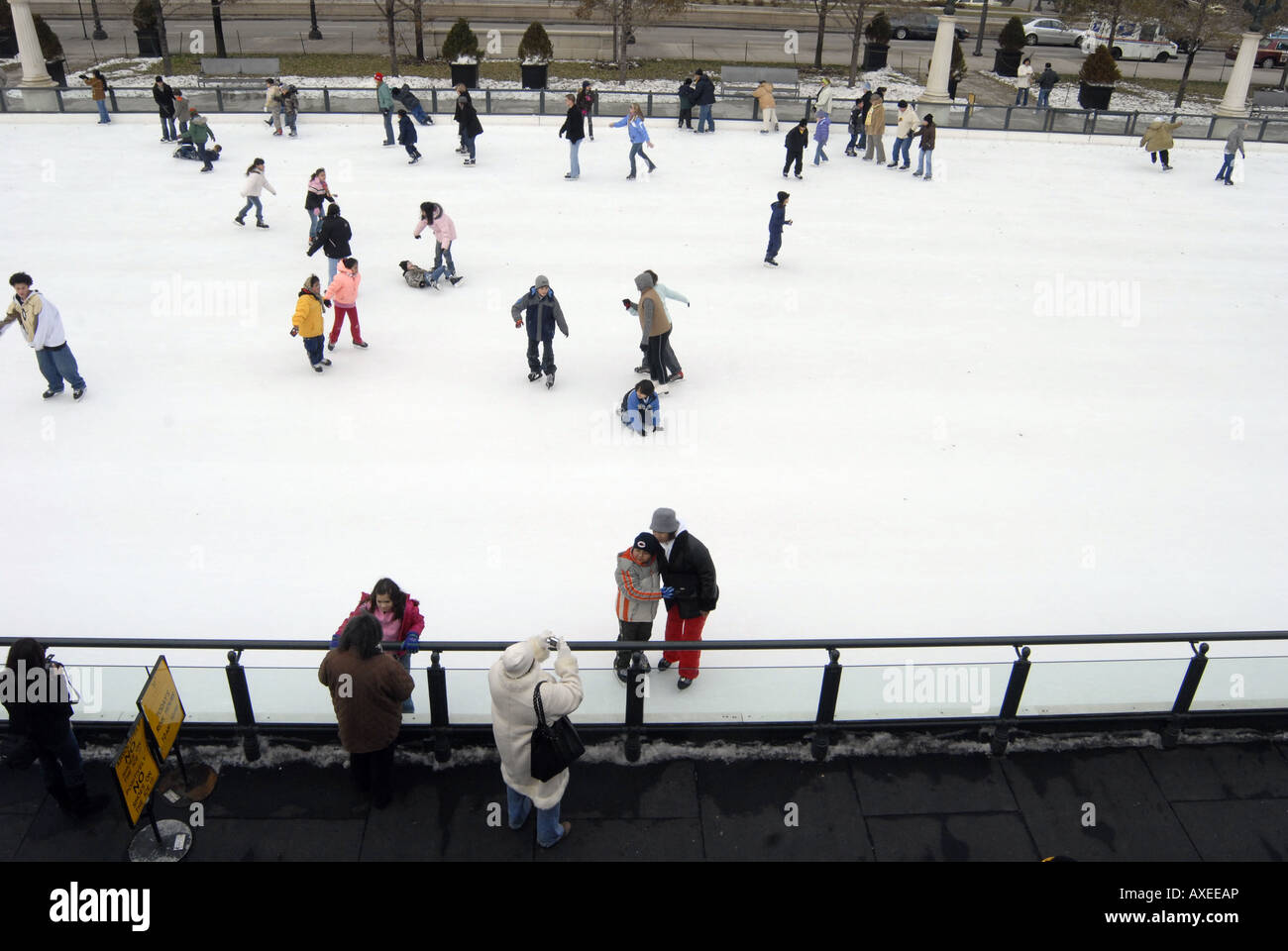 Ice skating at Millennium Park in Chicago with Michigan Avenue in the ...