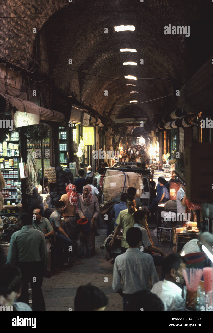 Syrian shoppers passing through one of the ancient passageways of the ...