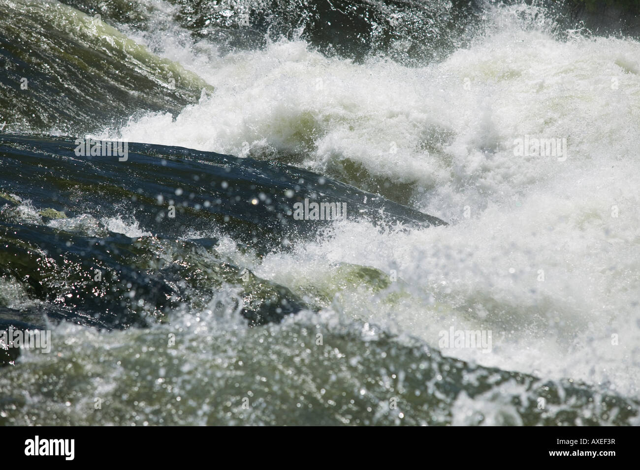 Africa Uganda Jinja Nile River flows over rapids at Bujagali Falls near ...