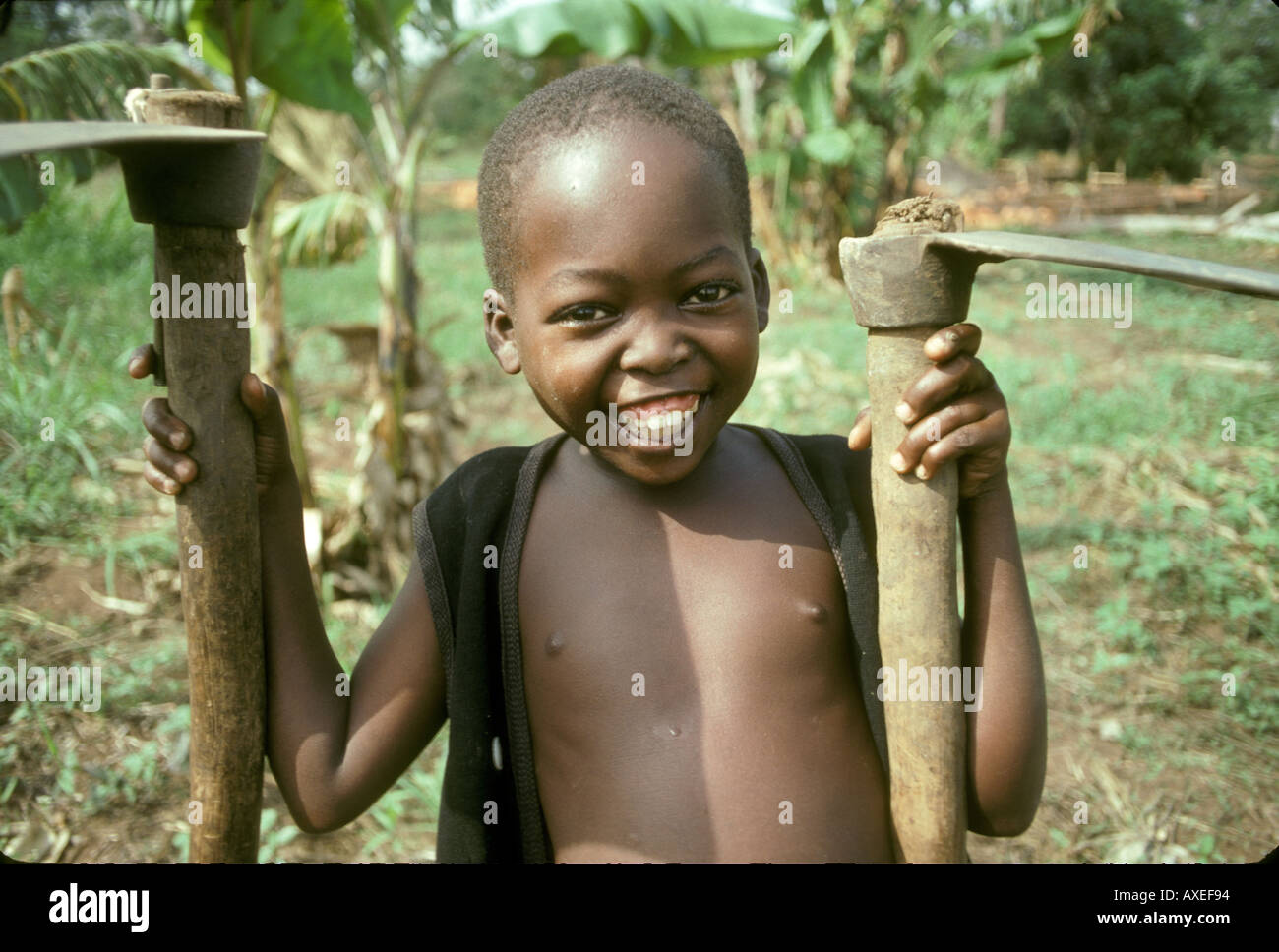Africa Tanzania Young boy workd on farm Stock Photo - Alamy