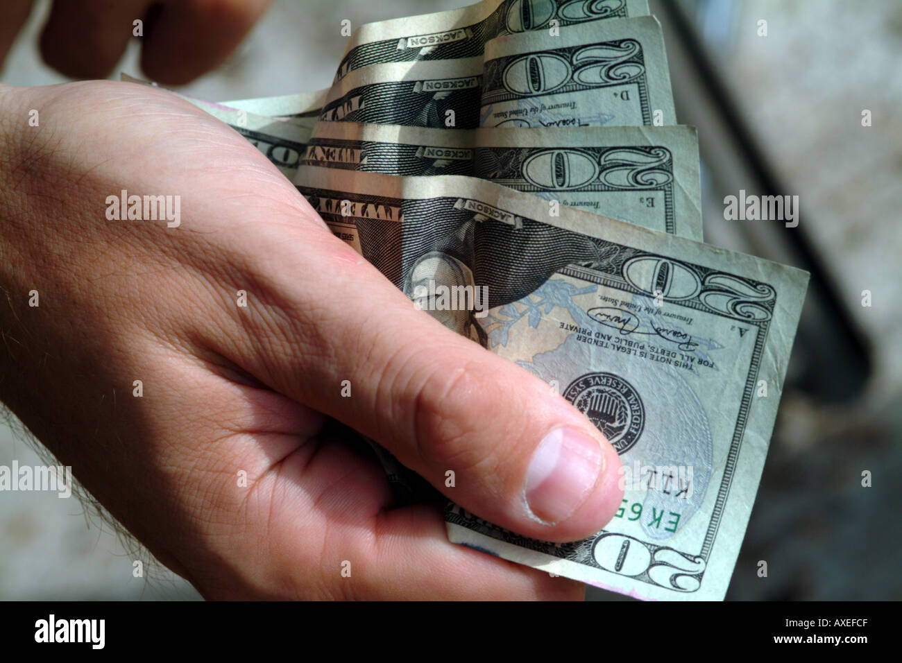 Hand holding 20 dollar bills hi-res stock photography and images - Alamy