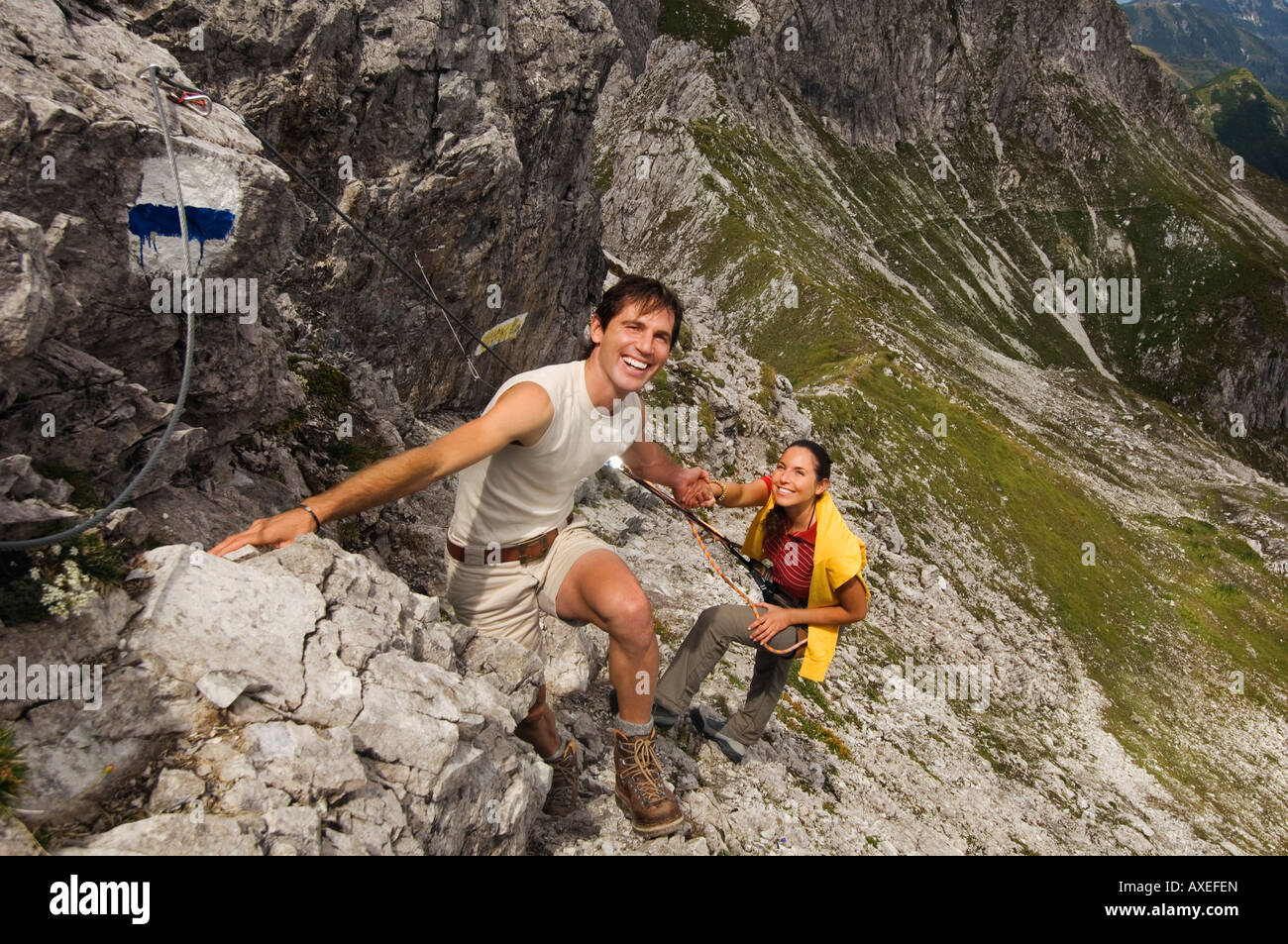 Austria, Salzburger Land, couple mountain climbing Stock Photo - Alamy