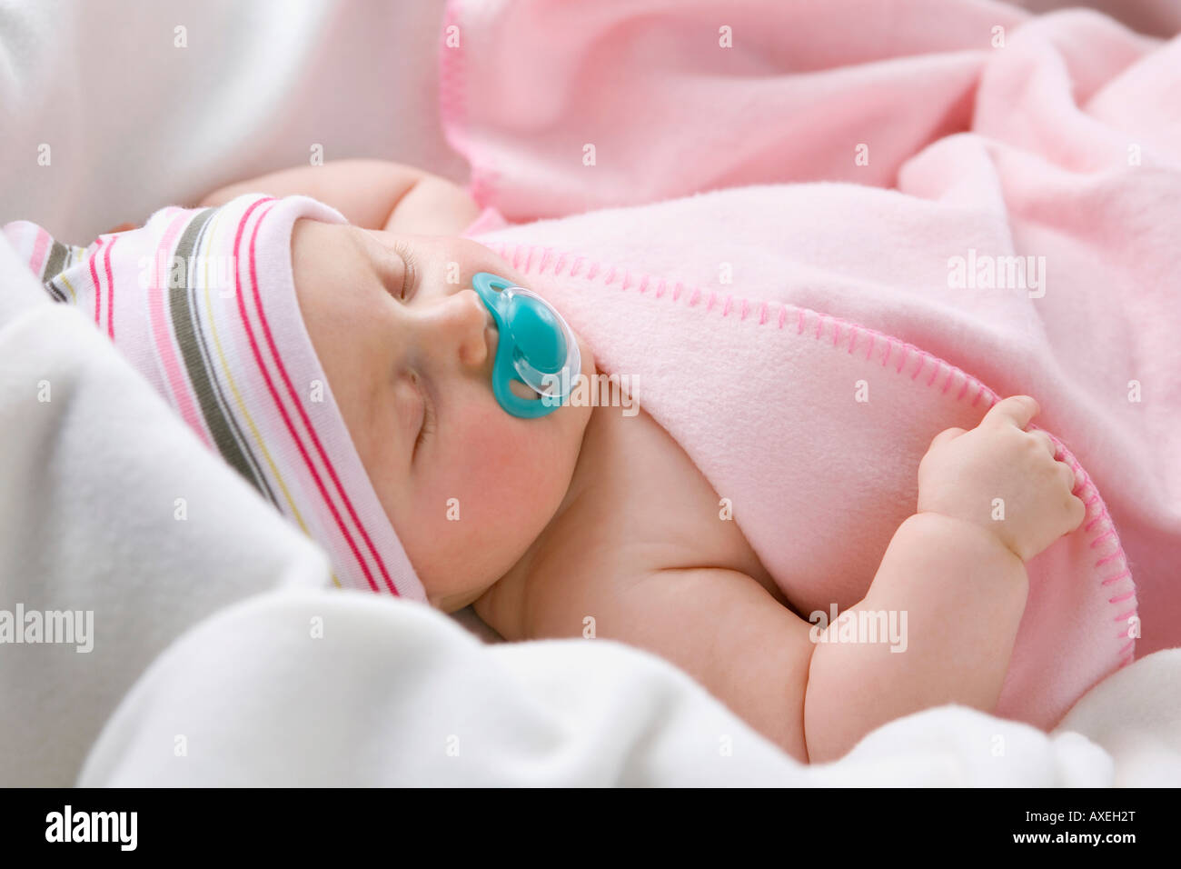 Baby boy (6-9 months) sleeping with pacifier, close-up Stock Photo - Alamy