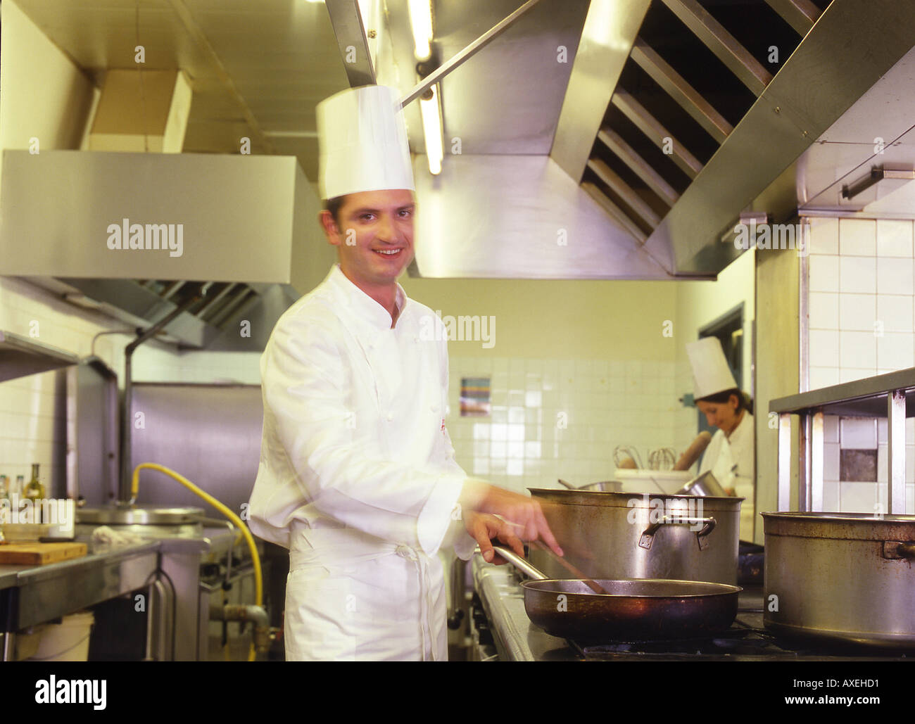 man male age 35 40 tall dark haired slim fit cook chef stand fry stir ...