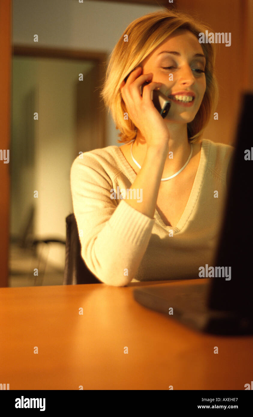 woman female age 30 35 blonde fair haired slim fit sit talk call ring ...