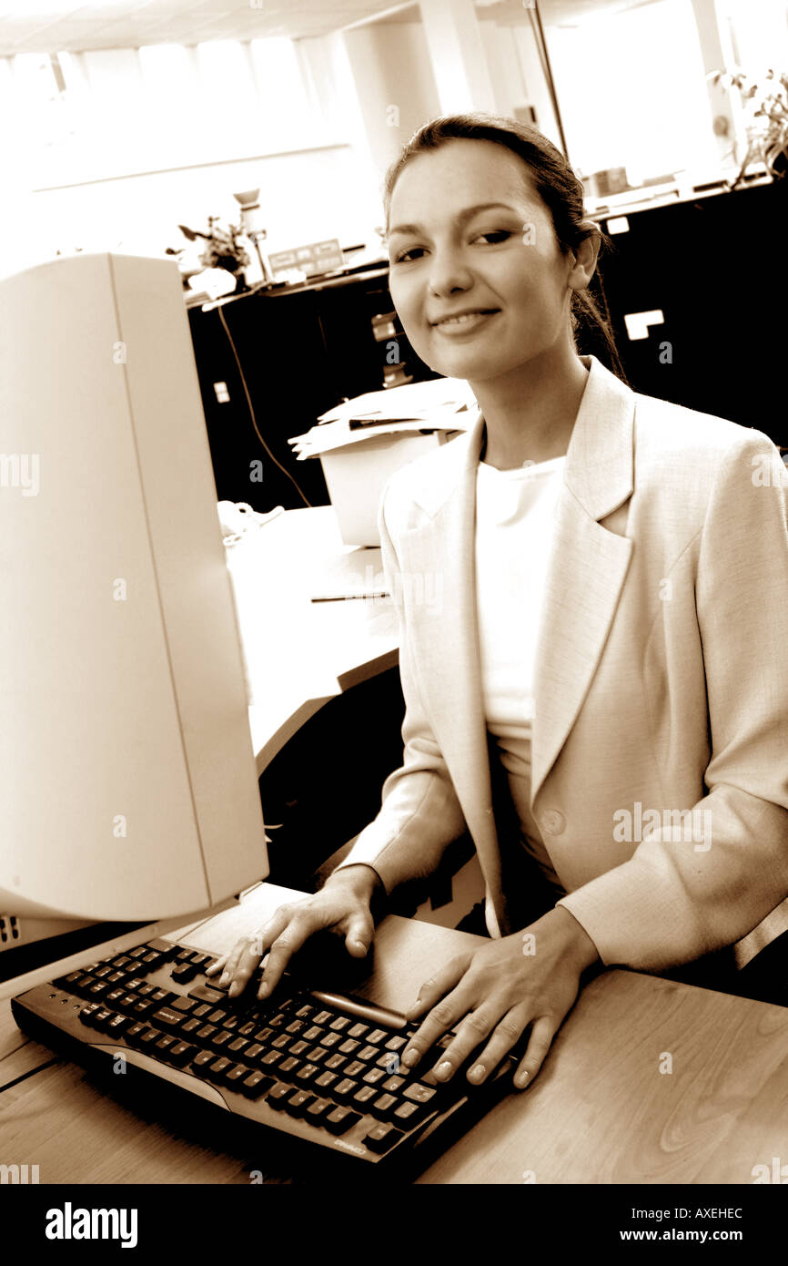 woman female age 35 30 adult businesswoman sit work smile write ...