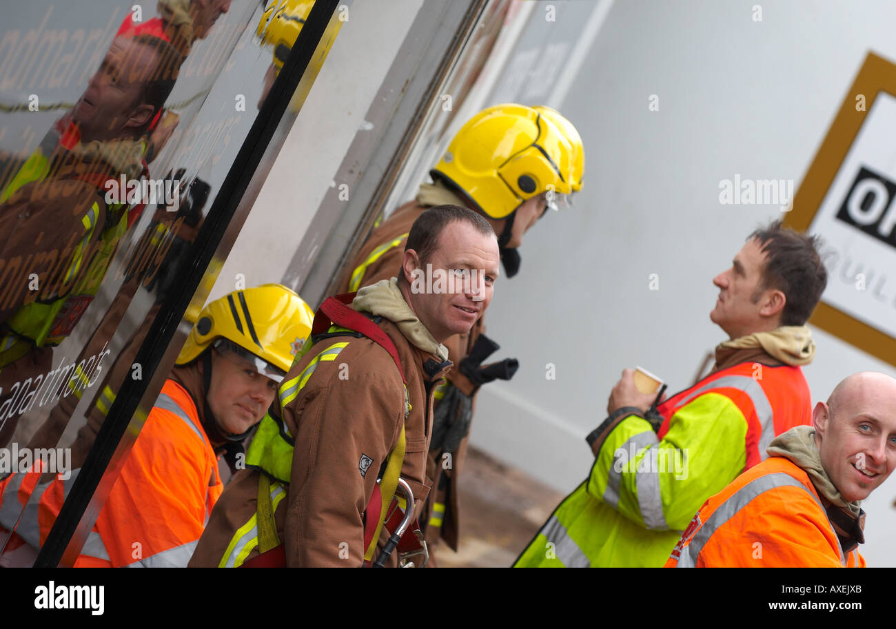 Firemen having a coffee break Stock Photo - Alamy
