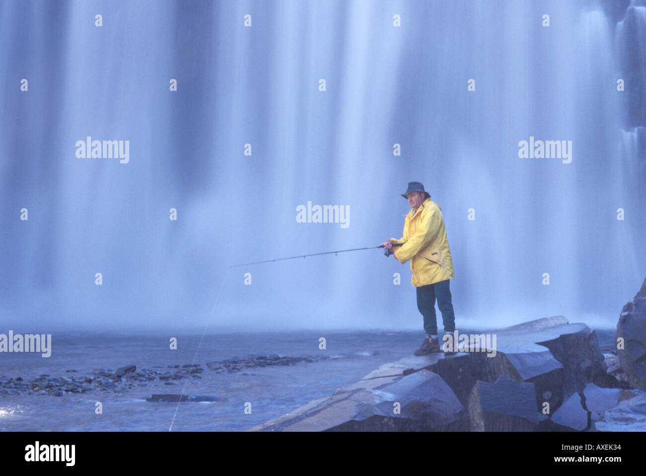 Man under waterfall hi-res stock photography and images - Alamy