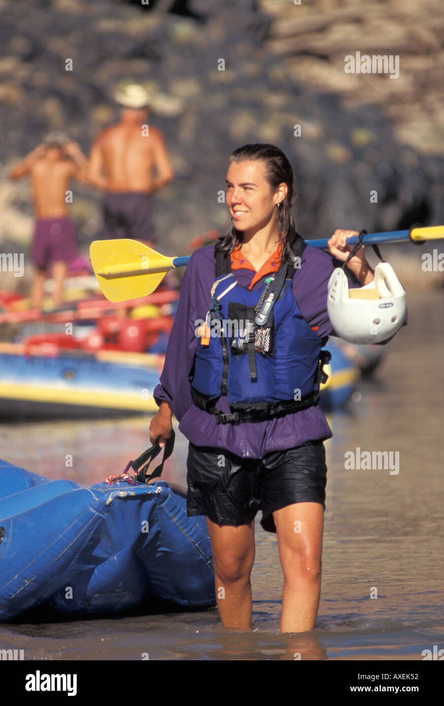 Woman Walking Her Inflatable Kayak Out Of The River Stock Photo - Alamy