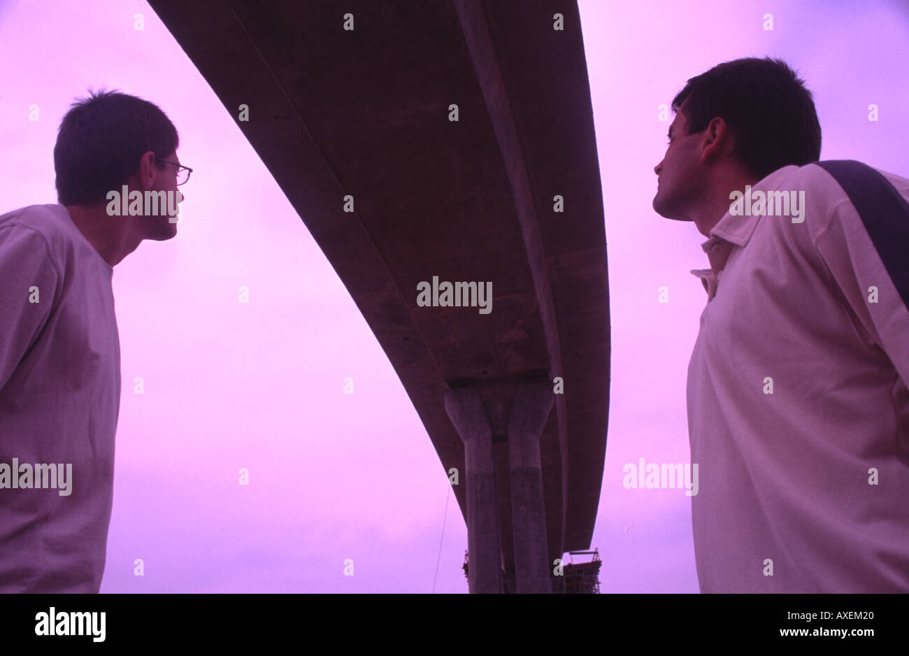 Two men under a bridge Stock Photo - Alamy