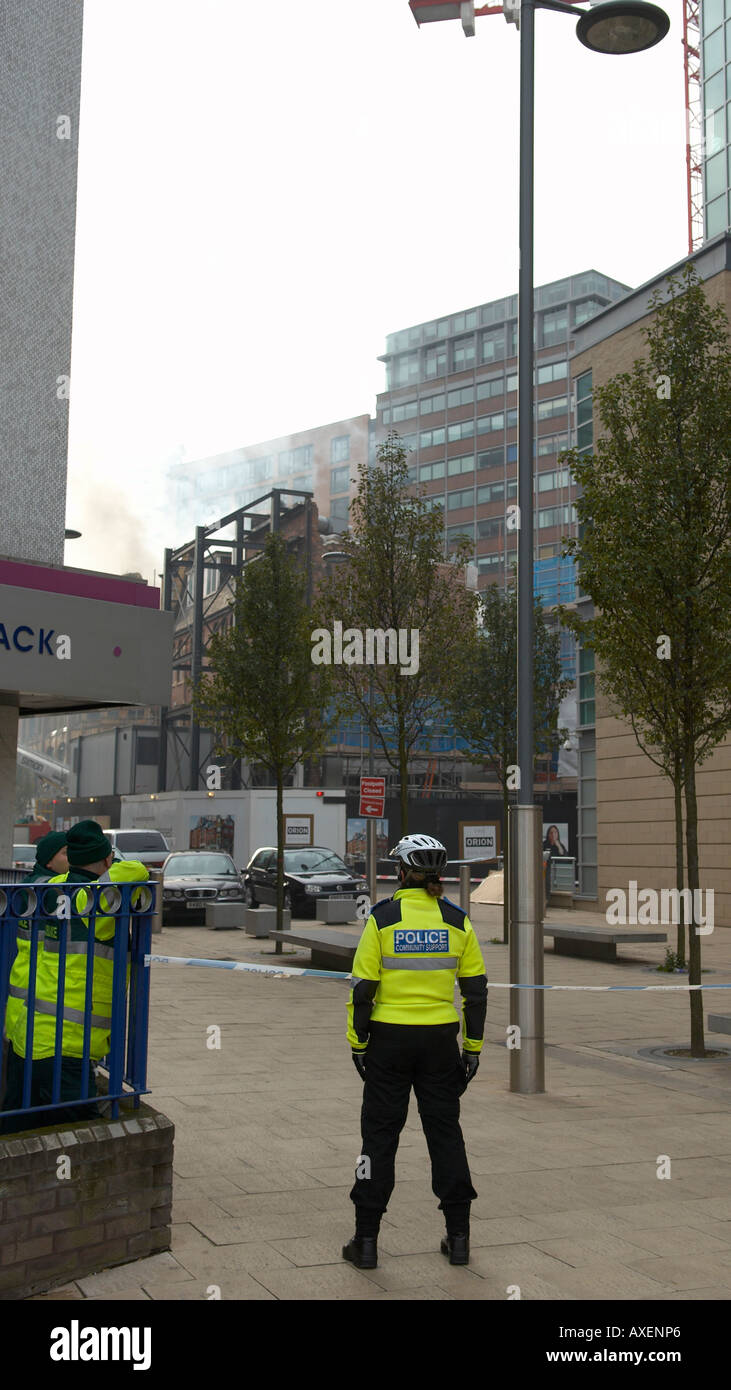 Bicycle mounted police officer standing outside the perimeter of an ...