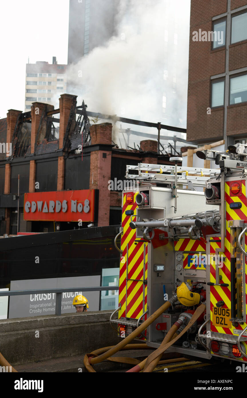 Fire engine at the scene of a fire with thick smoke Stock Photo - Alamy